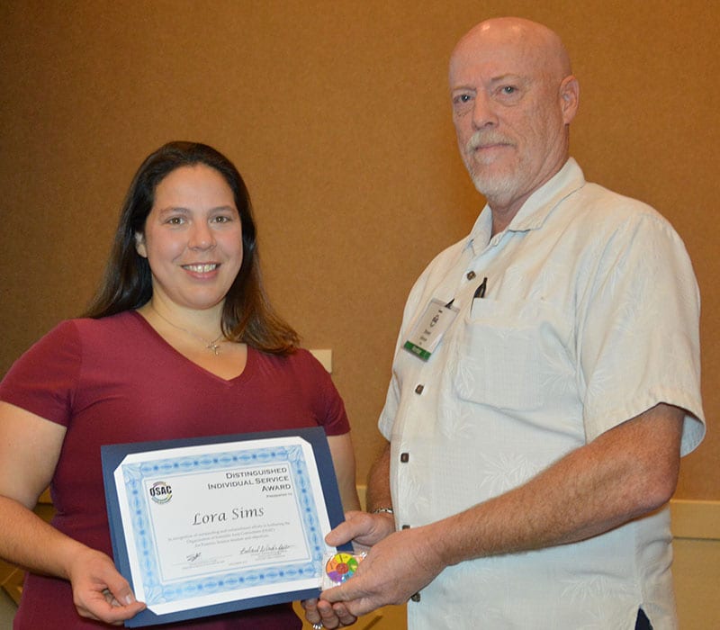 Lora Sims, Senior Biometric Examiner at I3, won a Distinguished Service ...